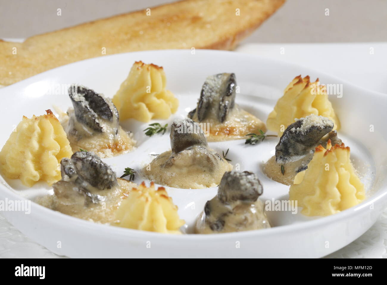 french vanilla baked snails Stock Photo - Alamy