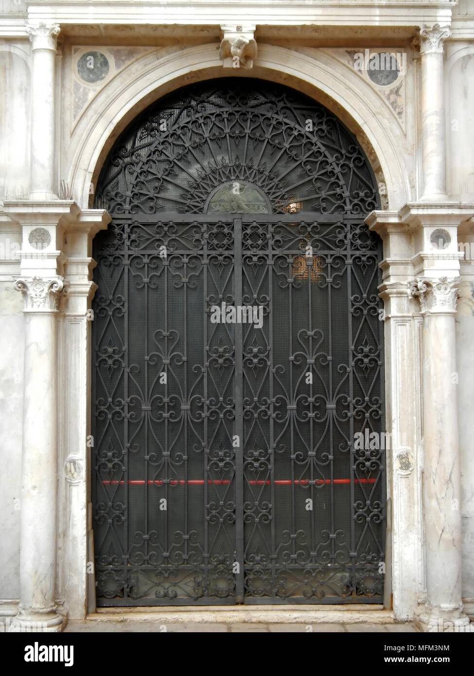 Ancient iron gate with marble surround, Venice, Italy Stock Photo - Alamy