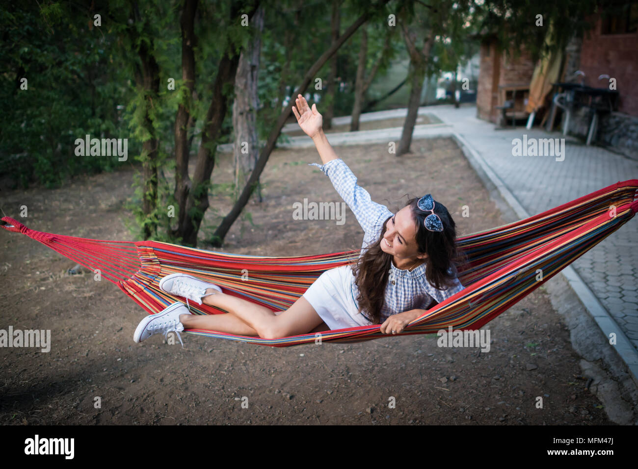 Girl lying in a hammock hi-res stock photography and images - Alamy
