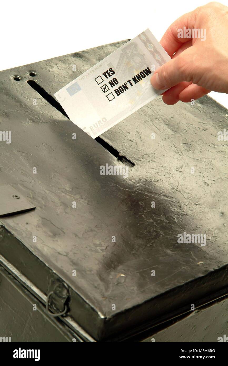 Close-up view on a black old fashioned metal ballot box with a hand ...