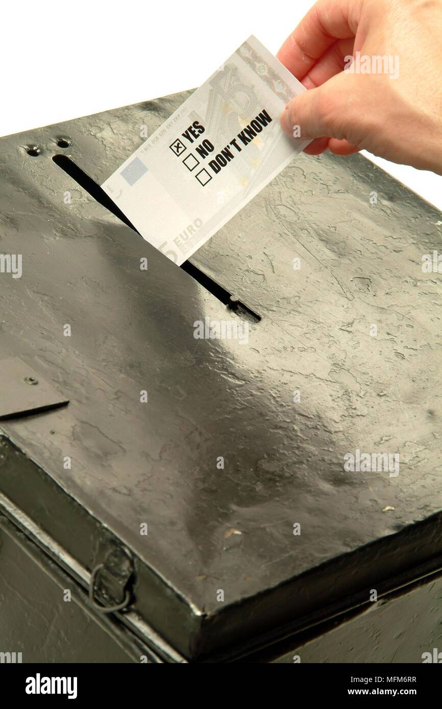 Close-up view on a black old fashioned metal ballot box with a hand ...