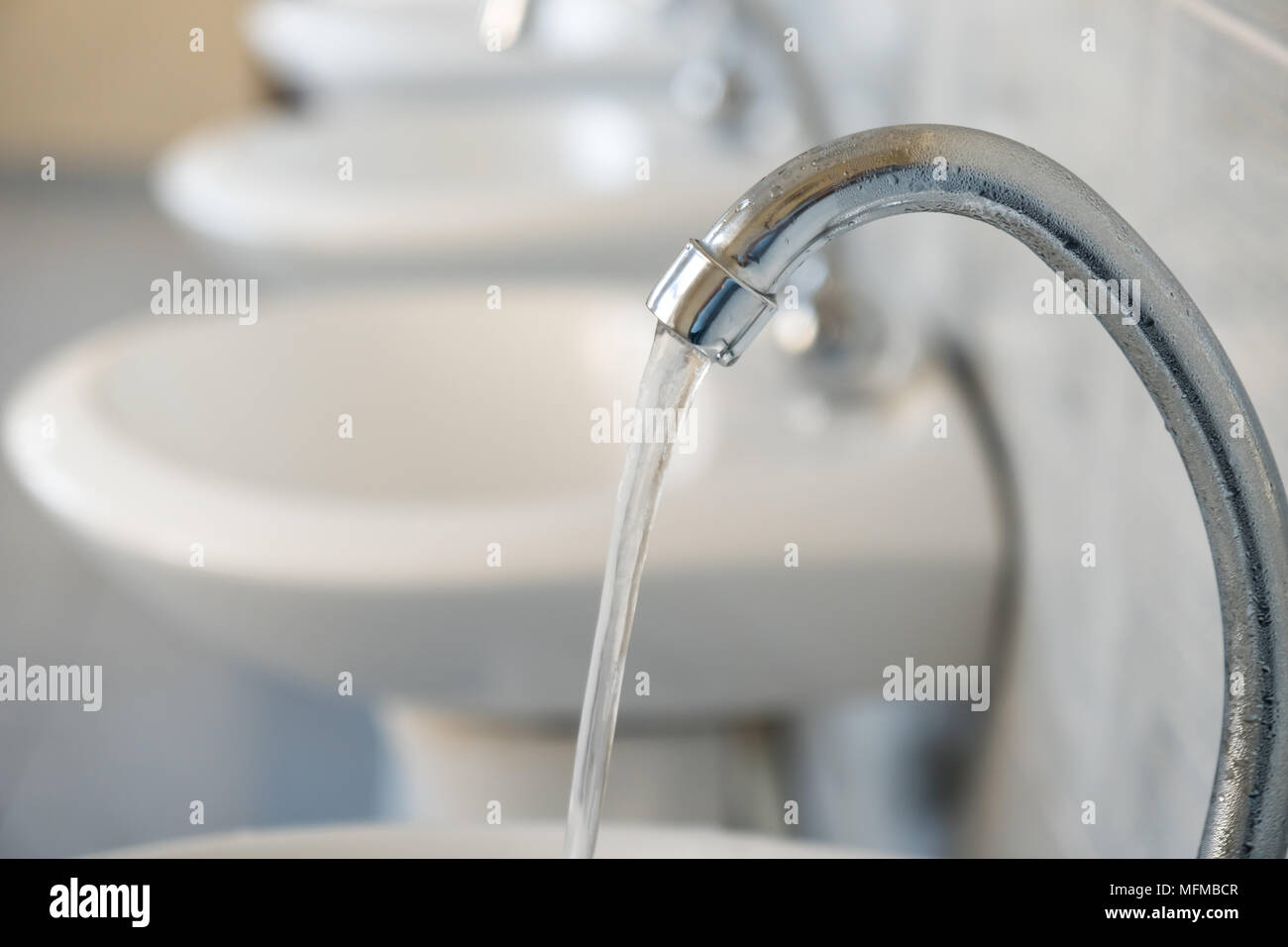 Public water taps in the school's toilet Stock Photo - Alamy