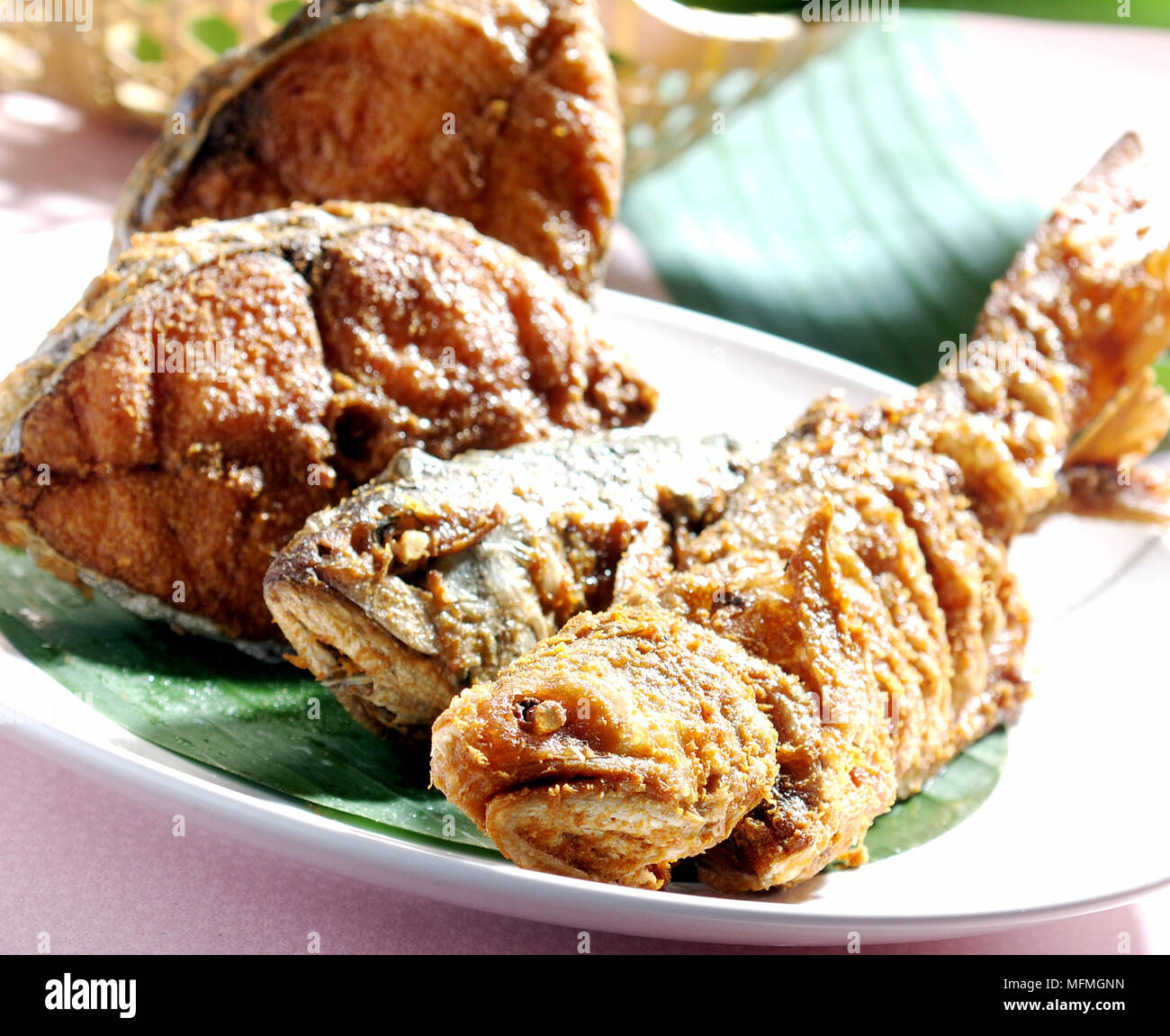 Fried fish in malaysia food Stock Photo - Alamy