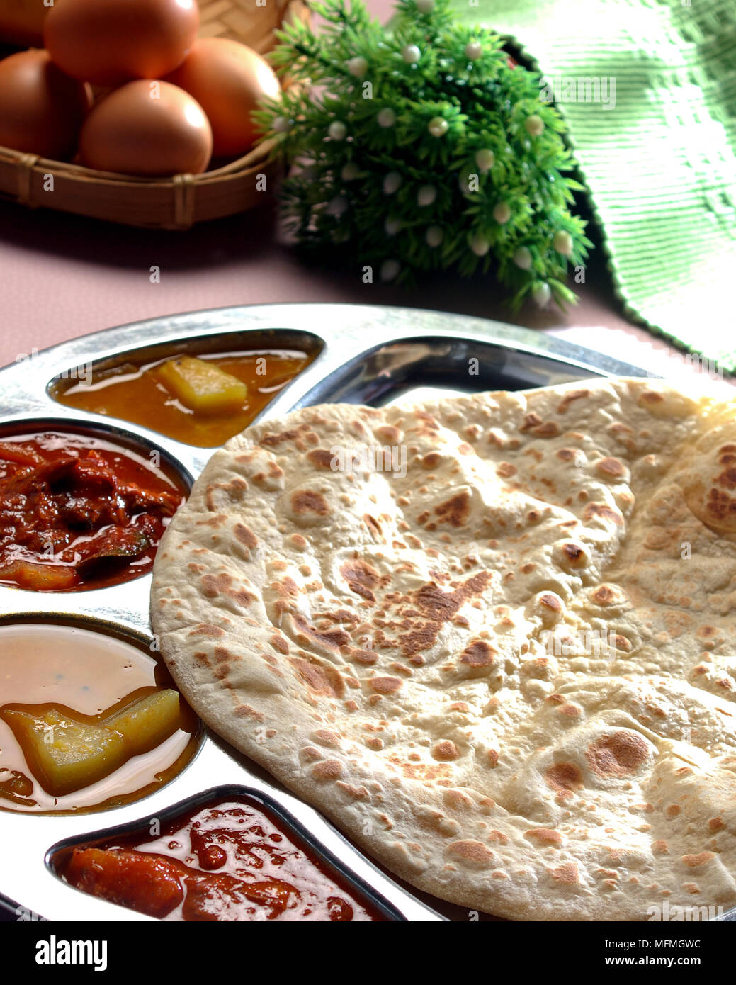 Roti canai, roti tisu, traditional south indian fried bread Stock Photo ...