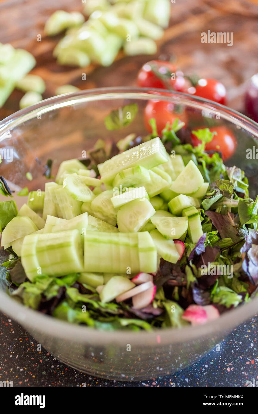 Preparing fresh salad with organic veggies Stock Photo - Alamy
