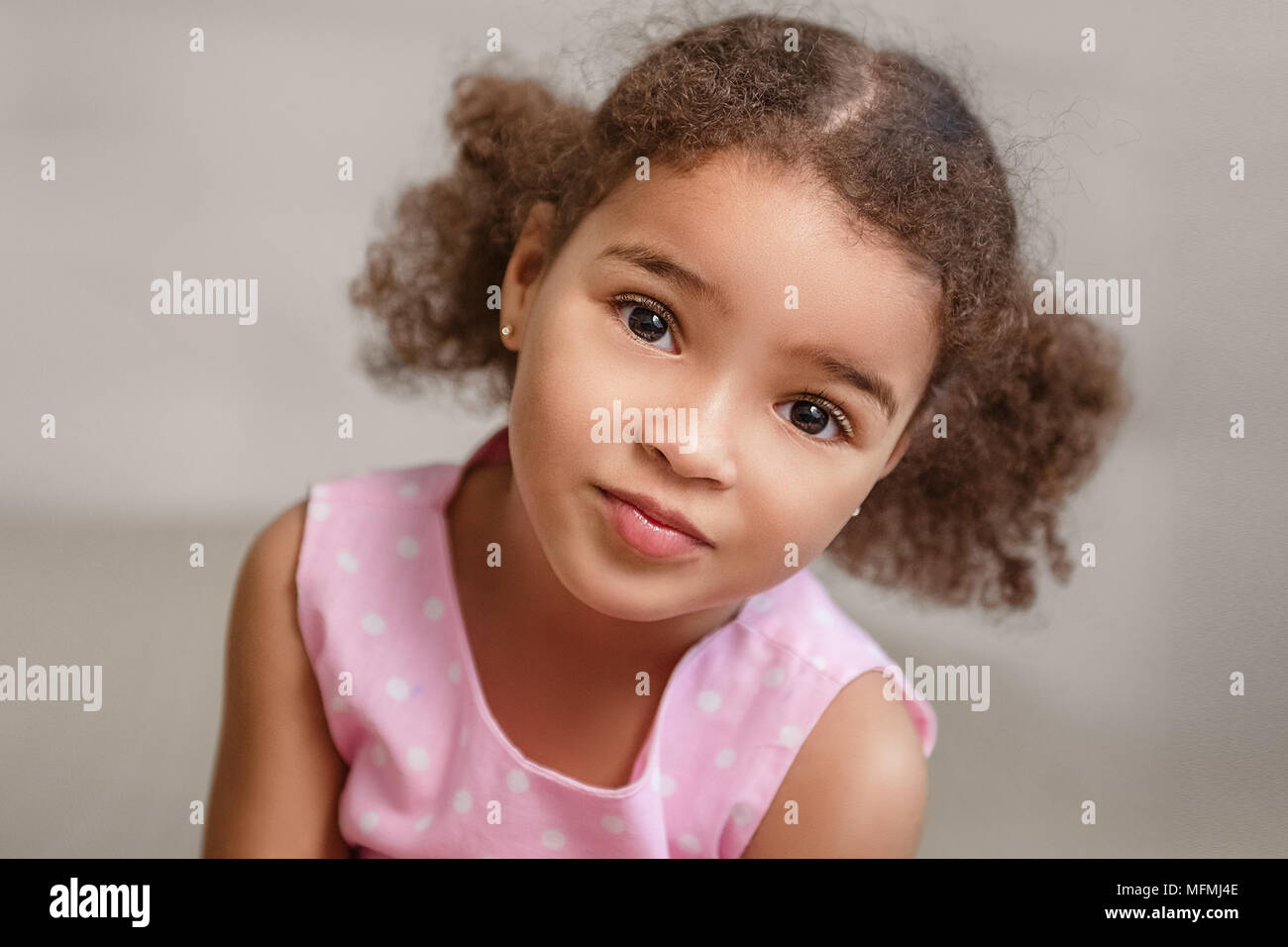 Beautiful young afro little girl infront Stock Photo - Alamy