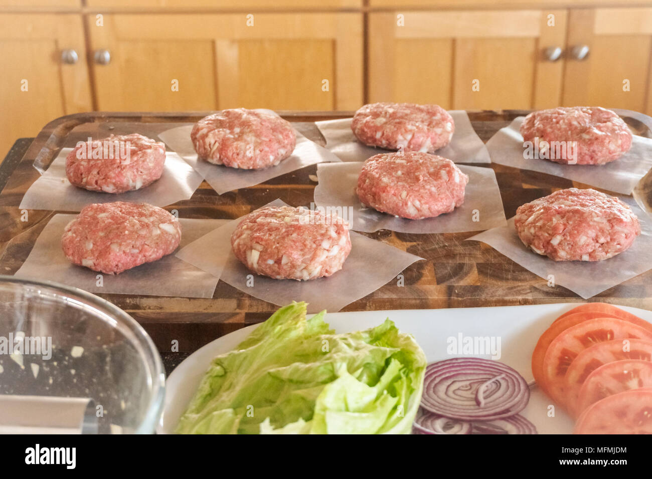 Preparing gourmet burger beef patties for classic burgers Stock Photo ...