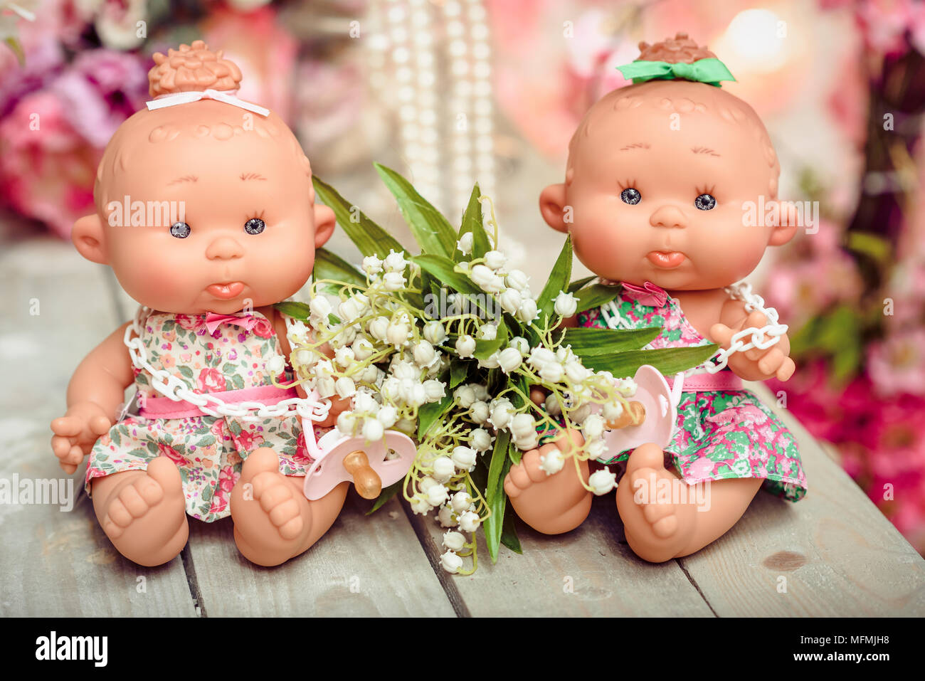 Beautiful girl, doll with flowers, floral wreath, bouquet, tied bows ...