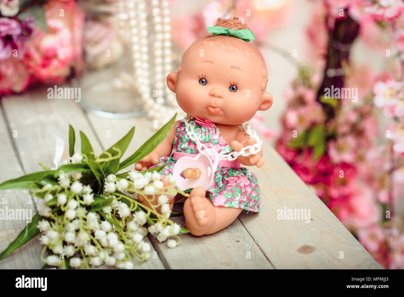 Beautiful girl, doll with flowers, floral wreath, bouquet, tied bows ...