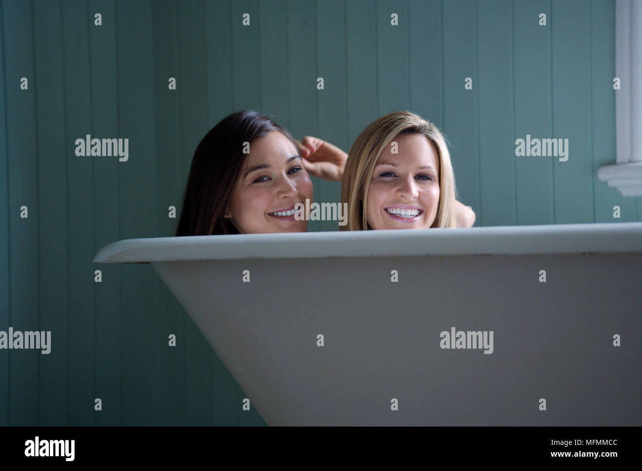 Two women in bathtub hi-res stock photography and images - Alamy