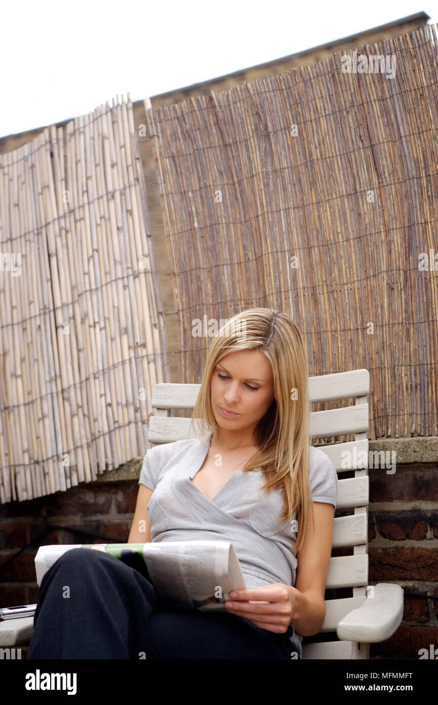 Sitting folding legs hi-res stock photography and images - Alamy