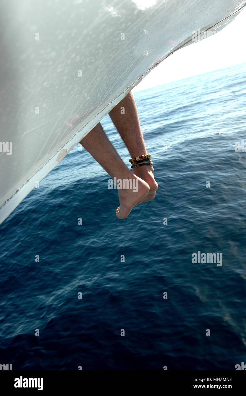 Close-up of a woman's leg under a boat's bow Ref: CRB416 10009 029 ...