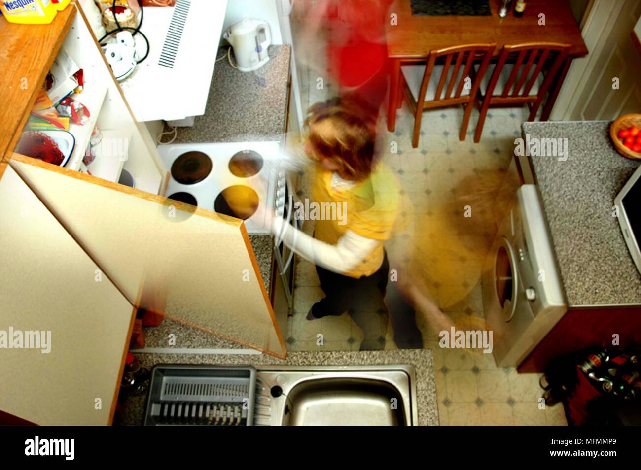 High angle view of a woman standing in the kitchen Ref: CRB416 10009 ...