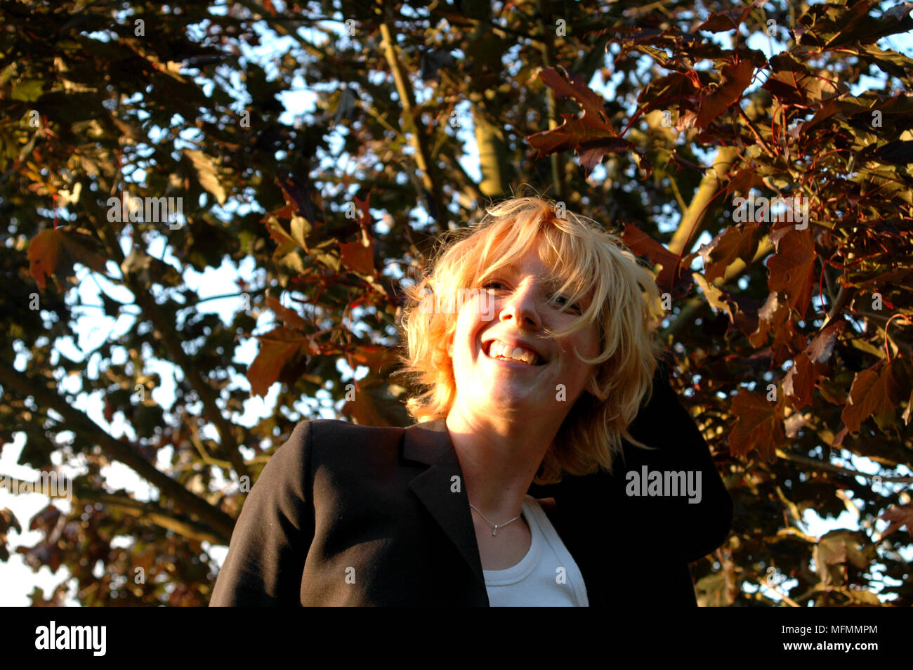 Low angle view of a young woman smiling Ref: CRB416 10009 070 ...
