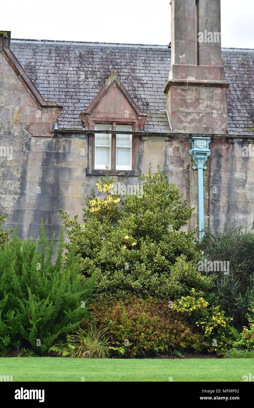 Wall detail with dormer window and chimney of 19th century stone ...