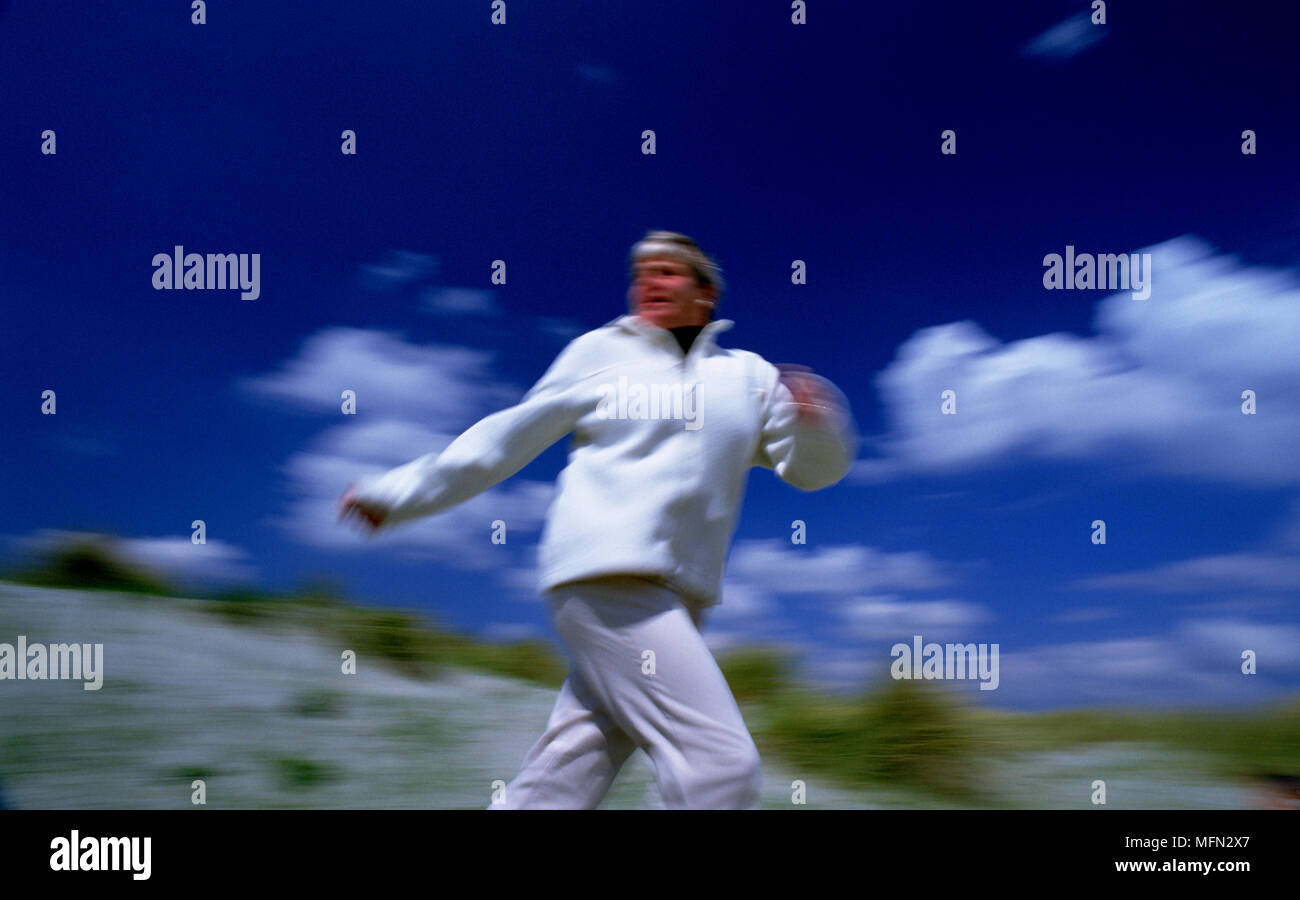 Woman running looking over shoulder hi-res stock photography and images ...