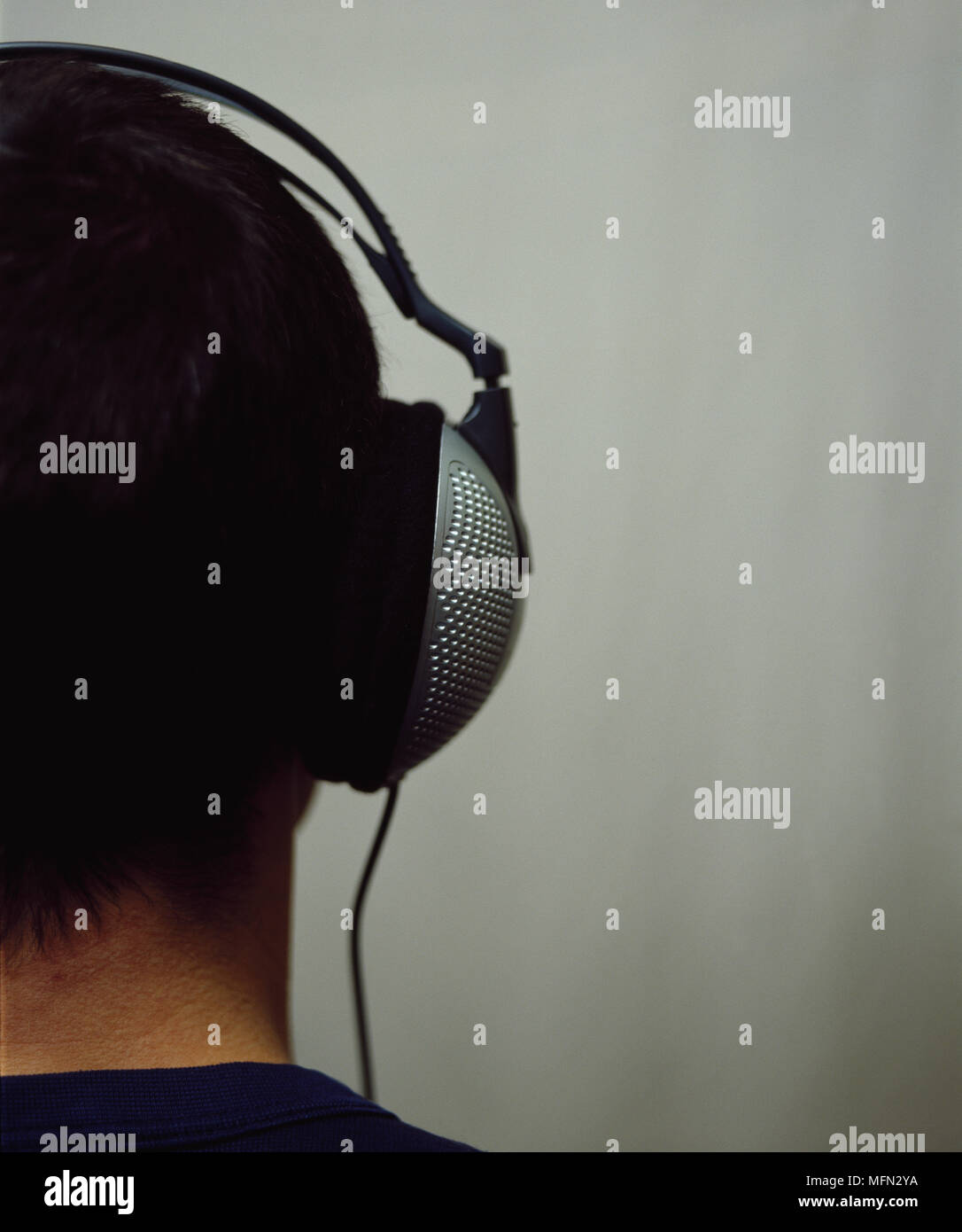 Rear view man wearing headphones hi-res stock photography and images ...