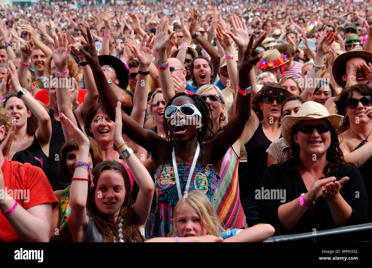 Crowd cheering with arms raised Ref: CRB360 10028 010 Compulsory Credit ...