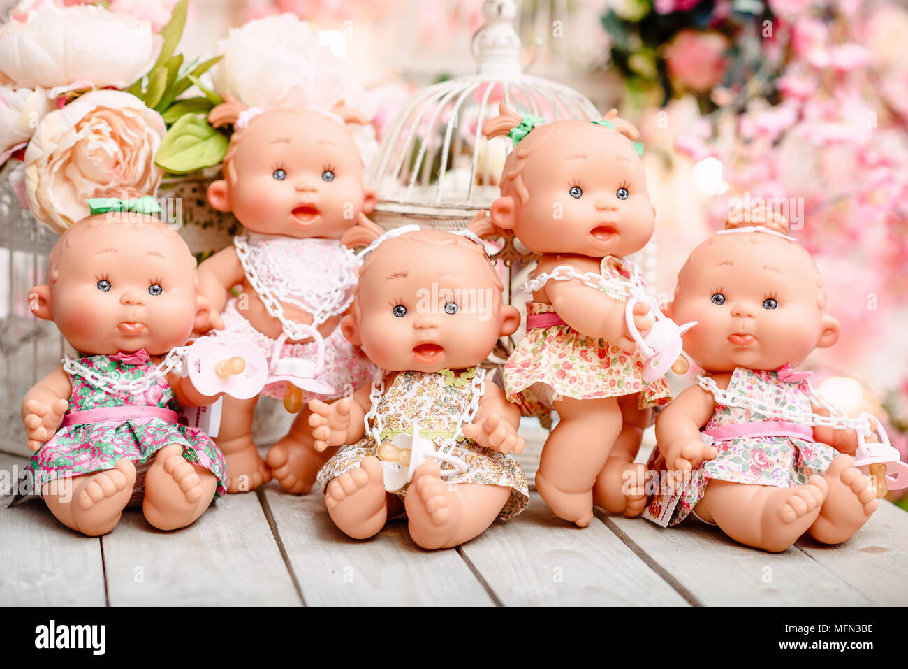 Beautiful girl, doll with flowers, floral wreath, bouquet, tied bows ...