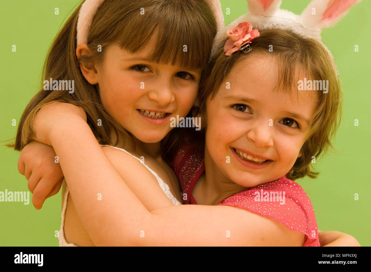 Close up two girls hugging other hi-res stock photography and images ...