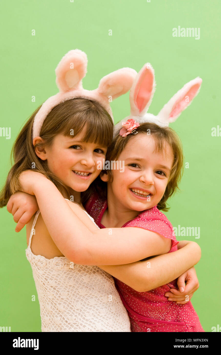 Portrait of two girls hugging each other Ref: Compulsory Credit Stock ...