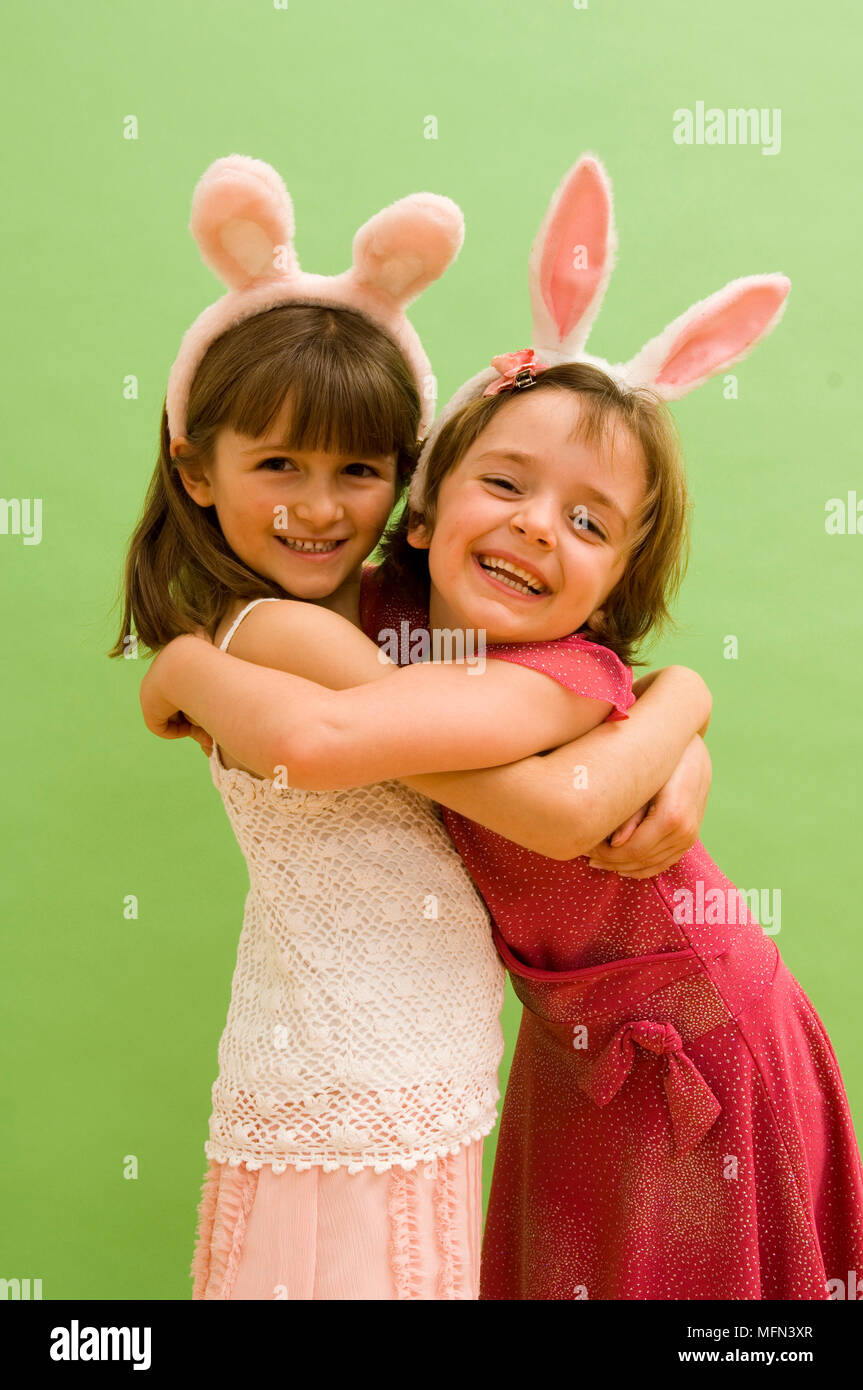 Portrait of two girls hugging each other Ref: Compulsory Credit Stock ...