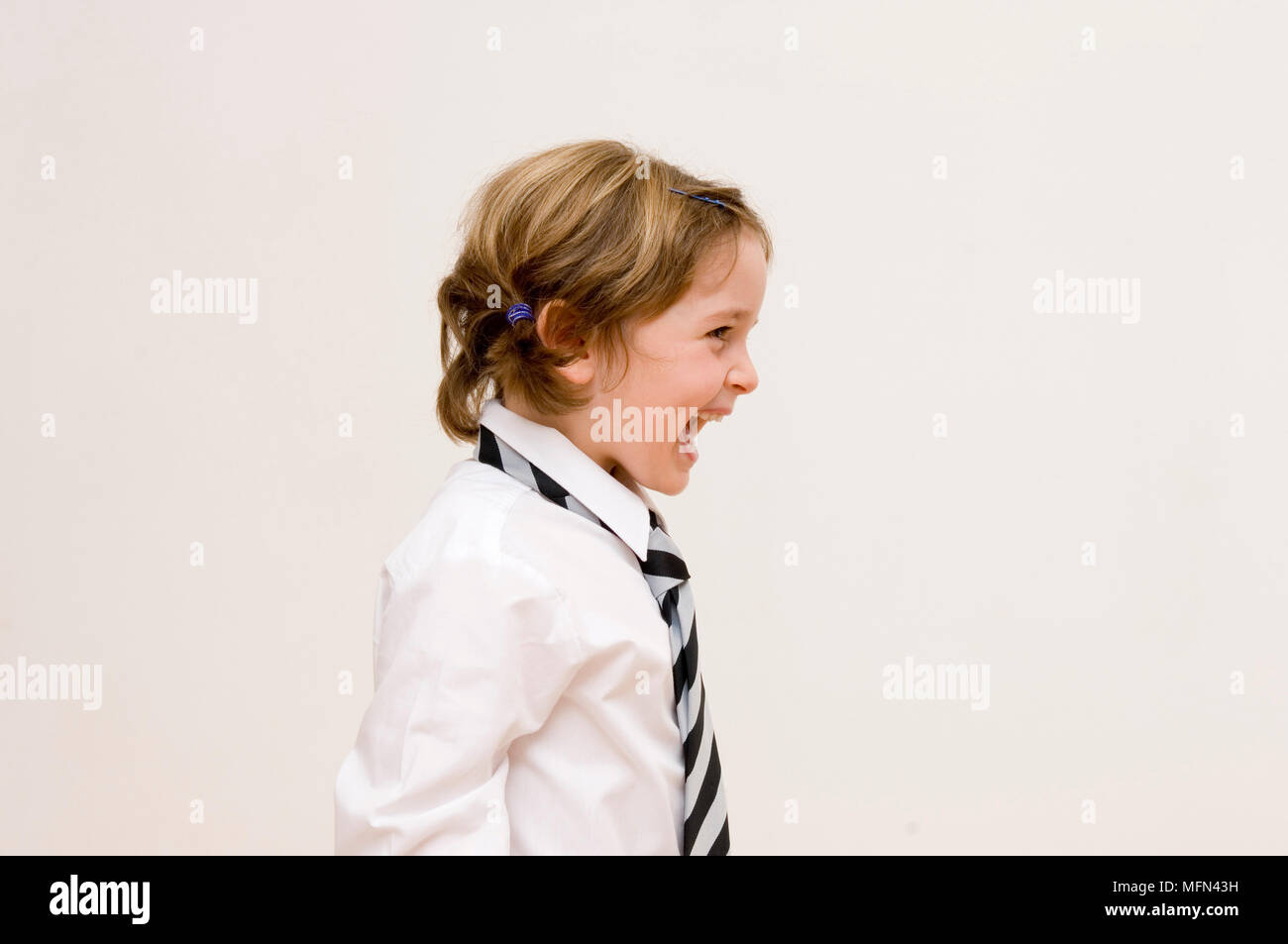 Side profile of a girl laughing Ref: Compulsory Credit Stock Photo - Alamy