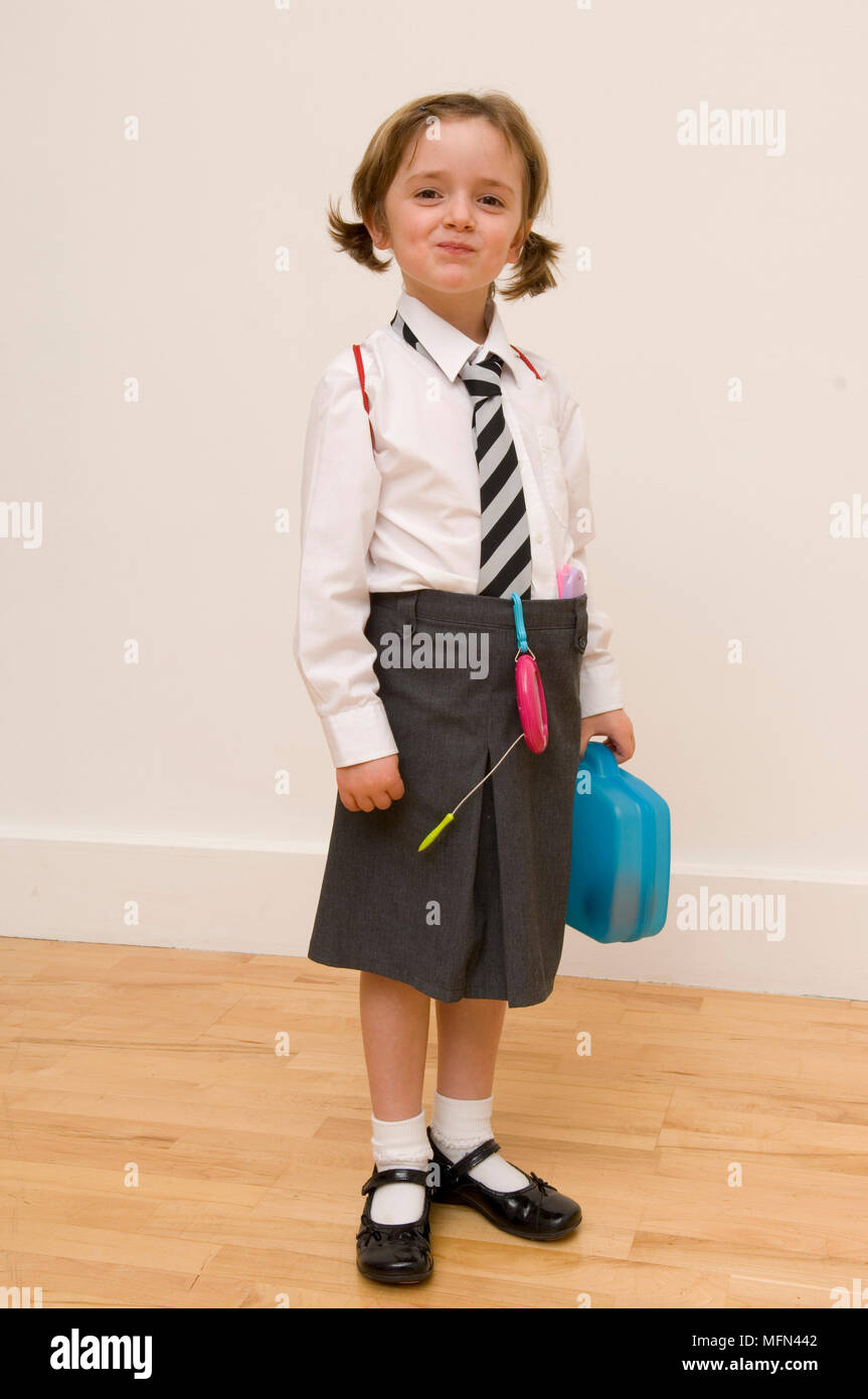 Portrait of a girl standing and smiling Ref: Compulsory Credit Stock ...