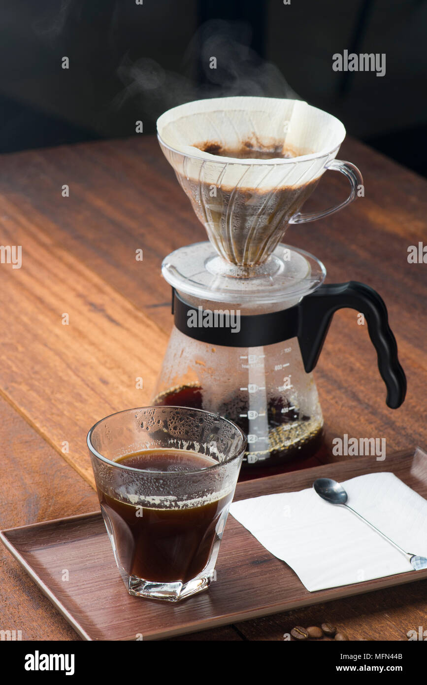 coffee drip process on wood background Stock Photo - Alamy