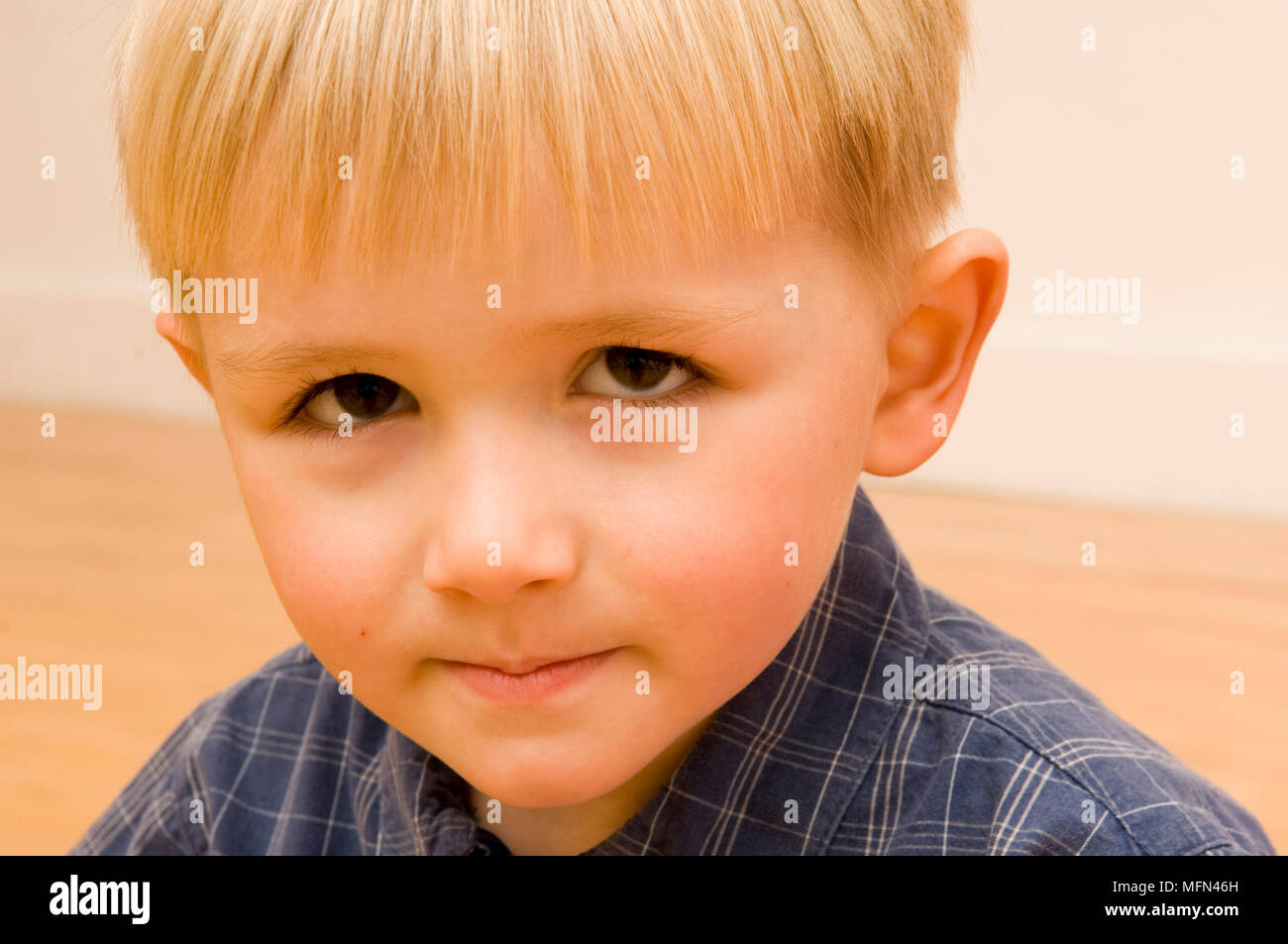 Portrait of a boy staring intently at the camera Ref: Compulsory Credit ...