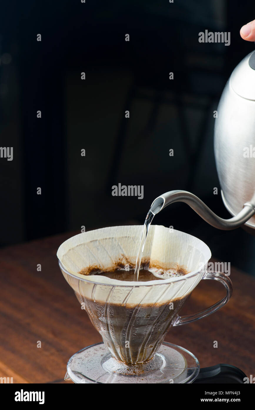 coffee drip process on wood background Stock Photo - Alamy