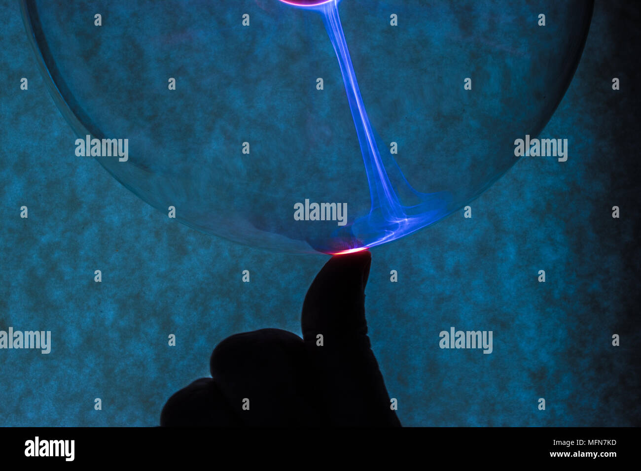 In the background is the hand that was illuminated by plasma from ...