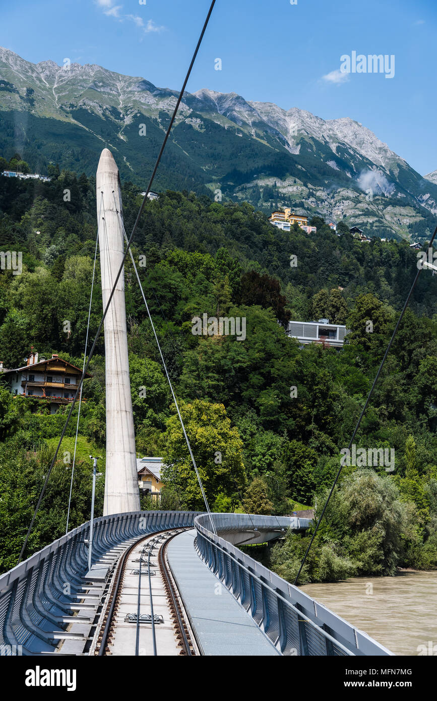 Cable railway bridge against Alps mountains in Innsbruck Stock Photo ...