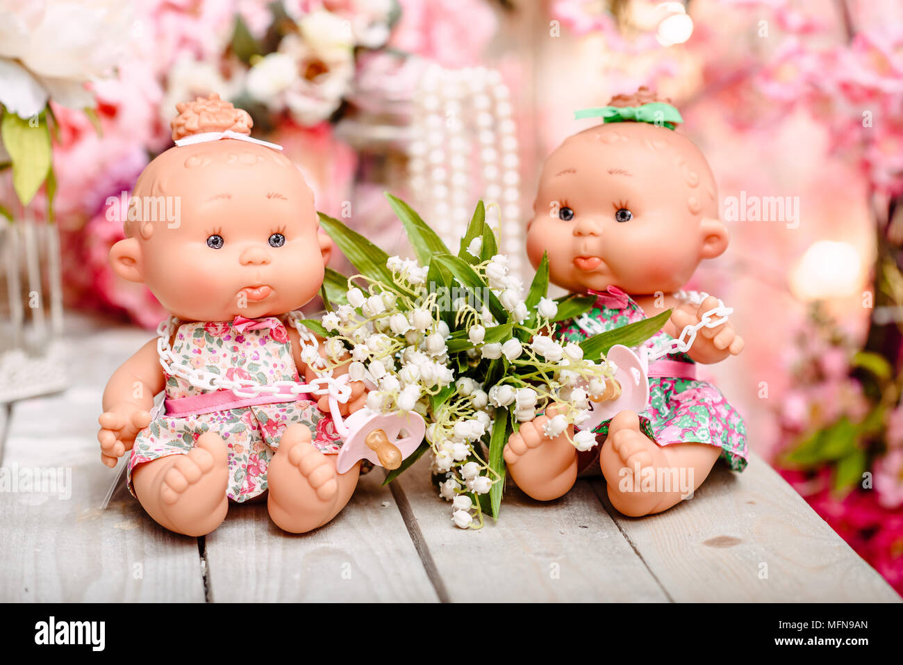 Girl doll with pink and violet flowers. Creative minimal fashion ...