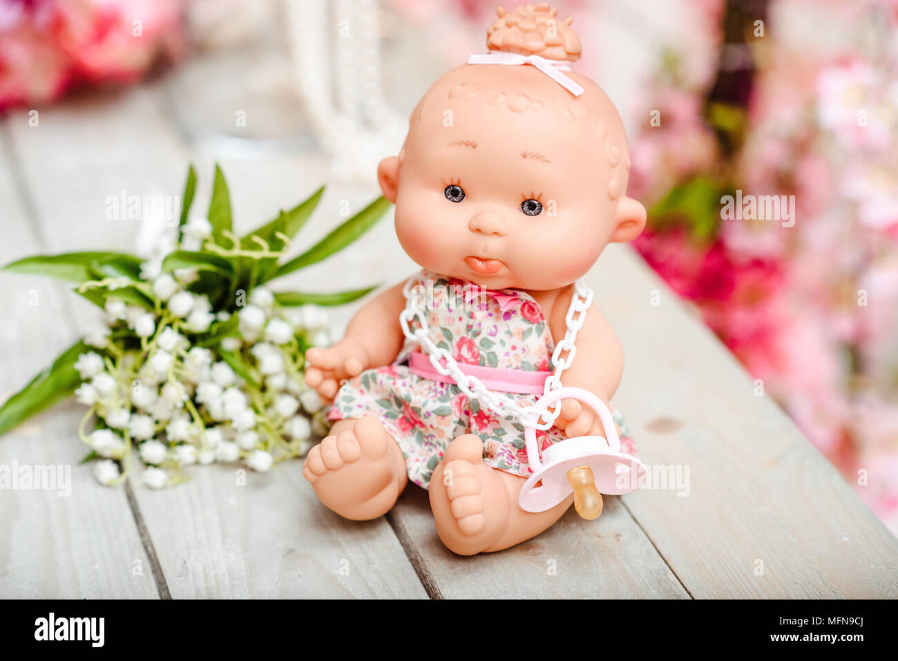 Beautiful girl, doll with flowers, floral wreath, bouquet, tied bows ...