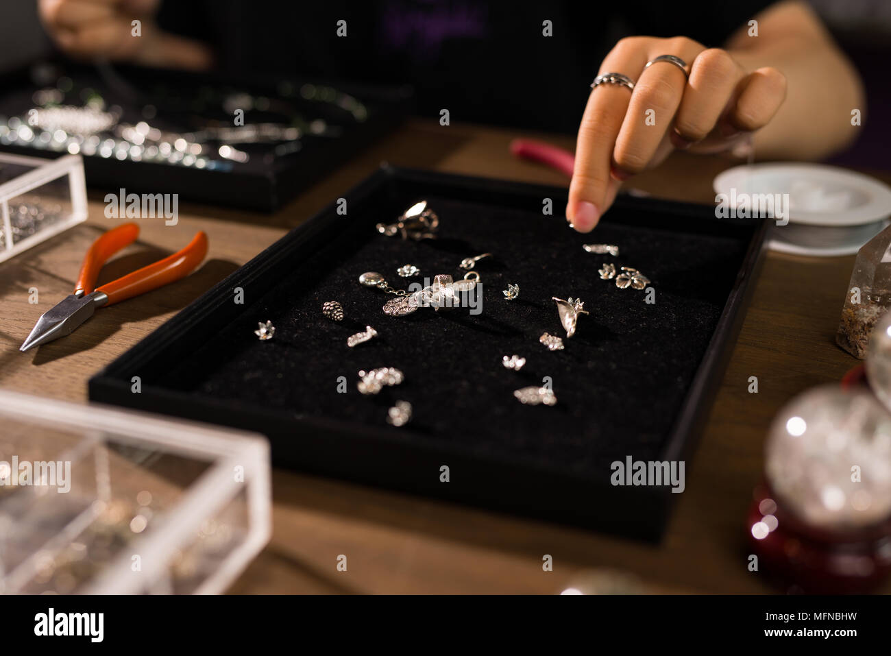 Female designer making jewelries at a jewelry shop Stock Photo - Alamy