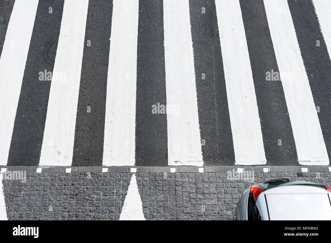 Car pass zebra crossing Stock Photo - Alamy