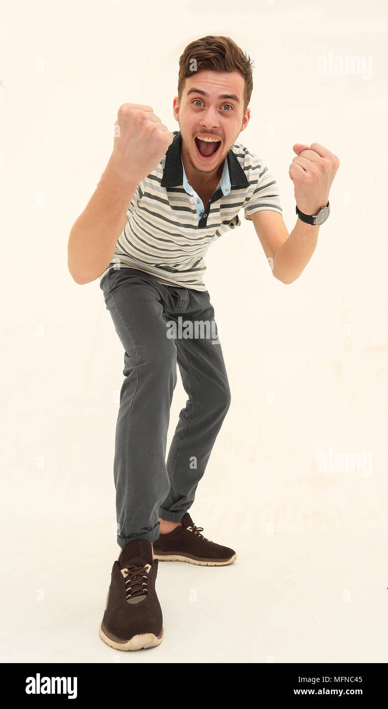 closeup. happy guy celebrating his success Stock Photo - Alamy