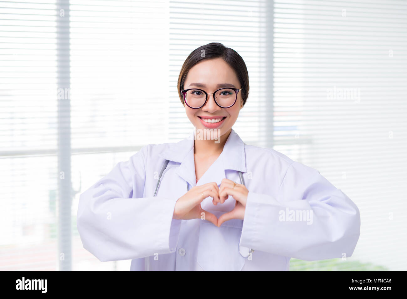 Female doctor hands with thumbs up gesture Stock Photo - Alamy