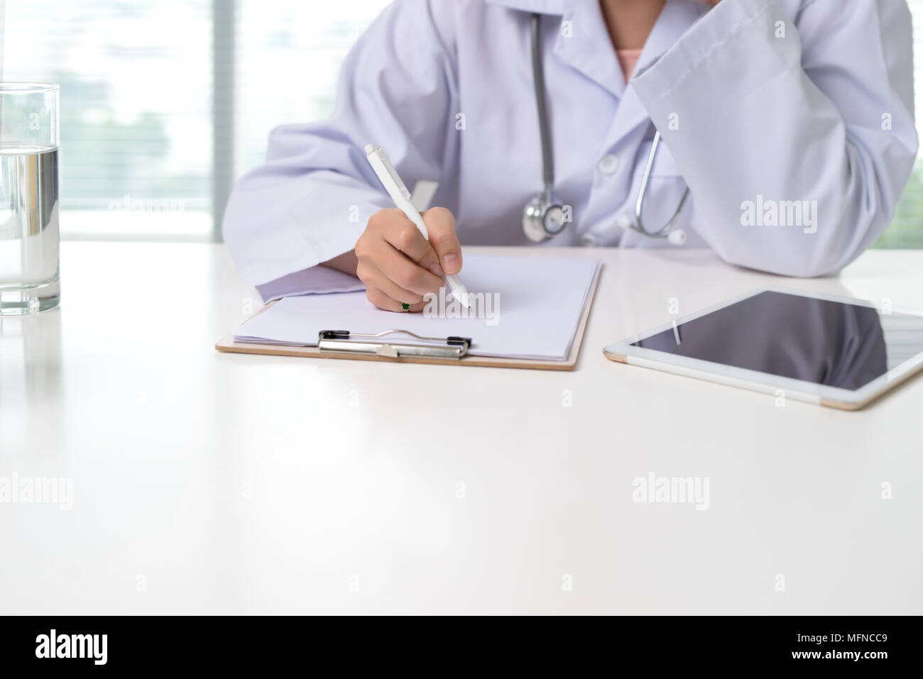 Female asian doctor writing hi-res stock photography and images - Alamy