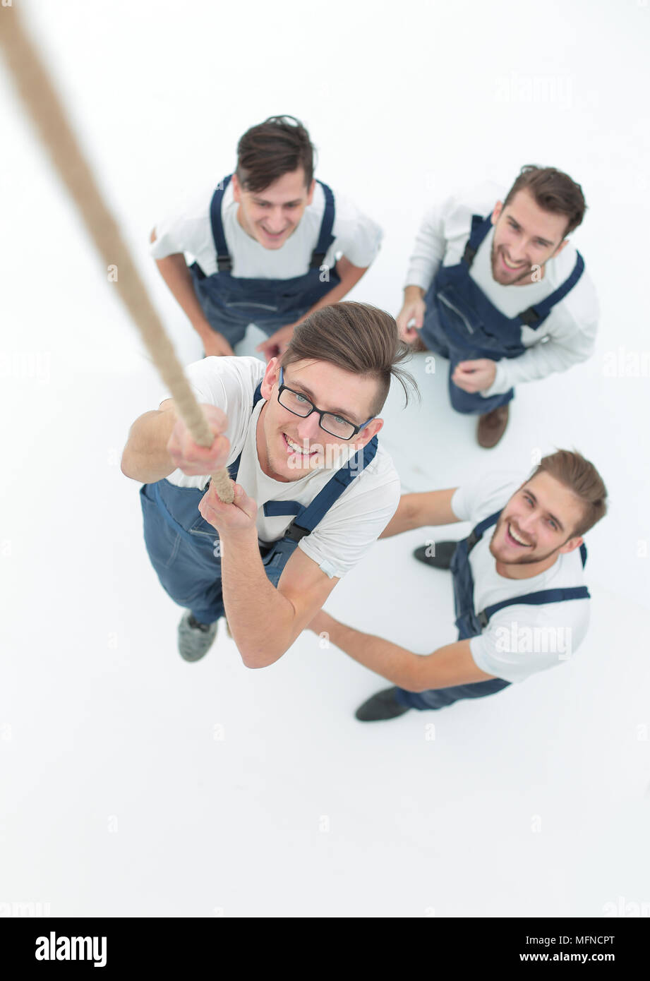 team, helping the leader to climb up the rope Stock Photo - Alamy