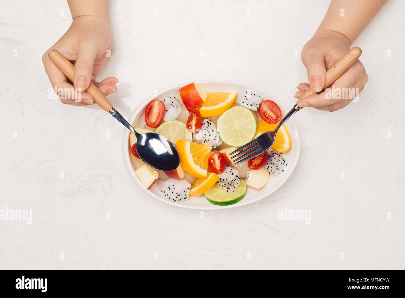 Fresh mixed fruit salad in bowl of salad Stock Photo - Alamy