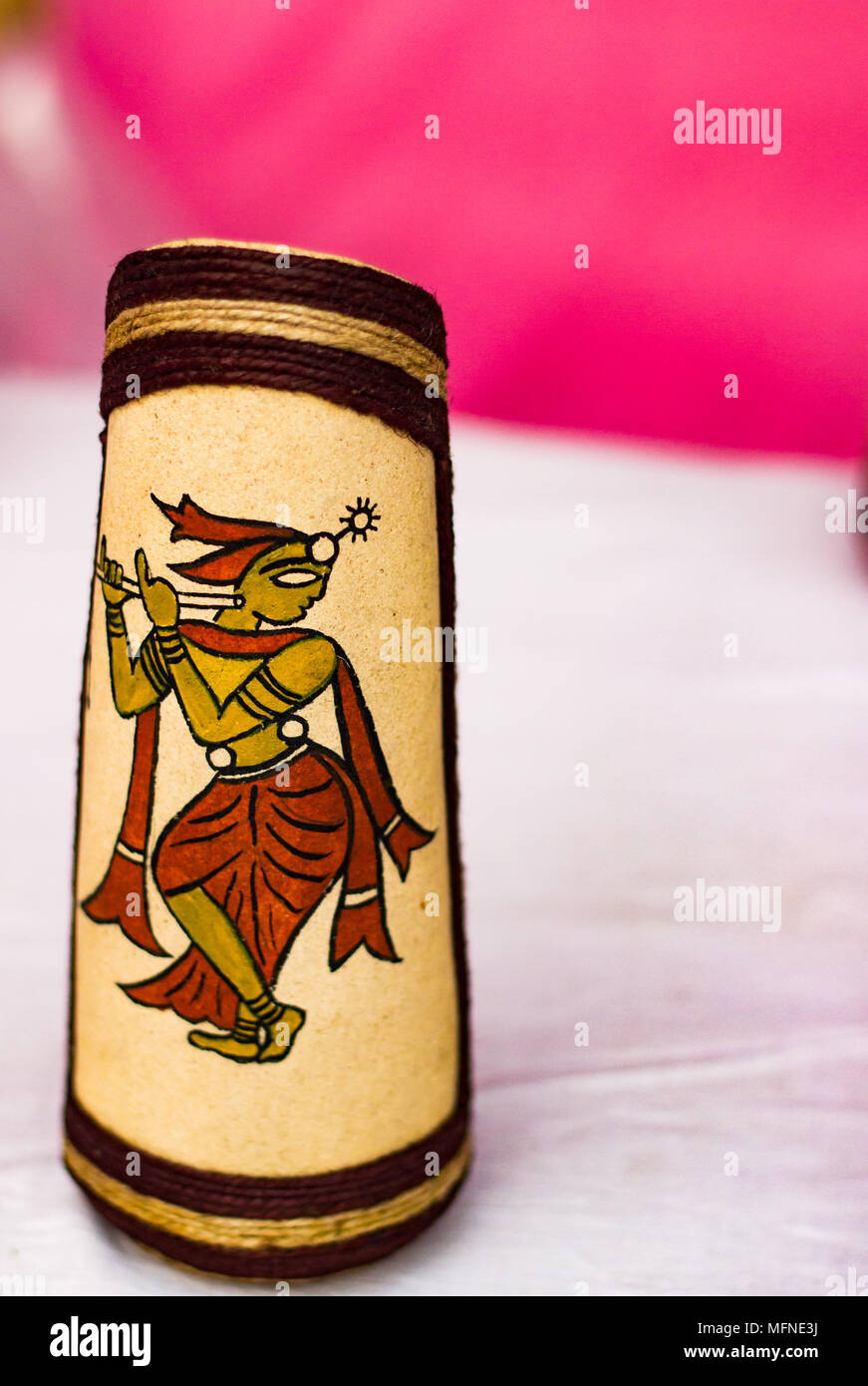 colourful figure of lord krishna drawn on a vase. indian god mythology ...