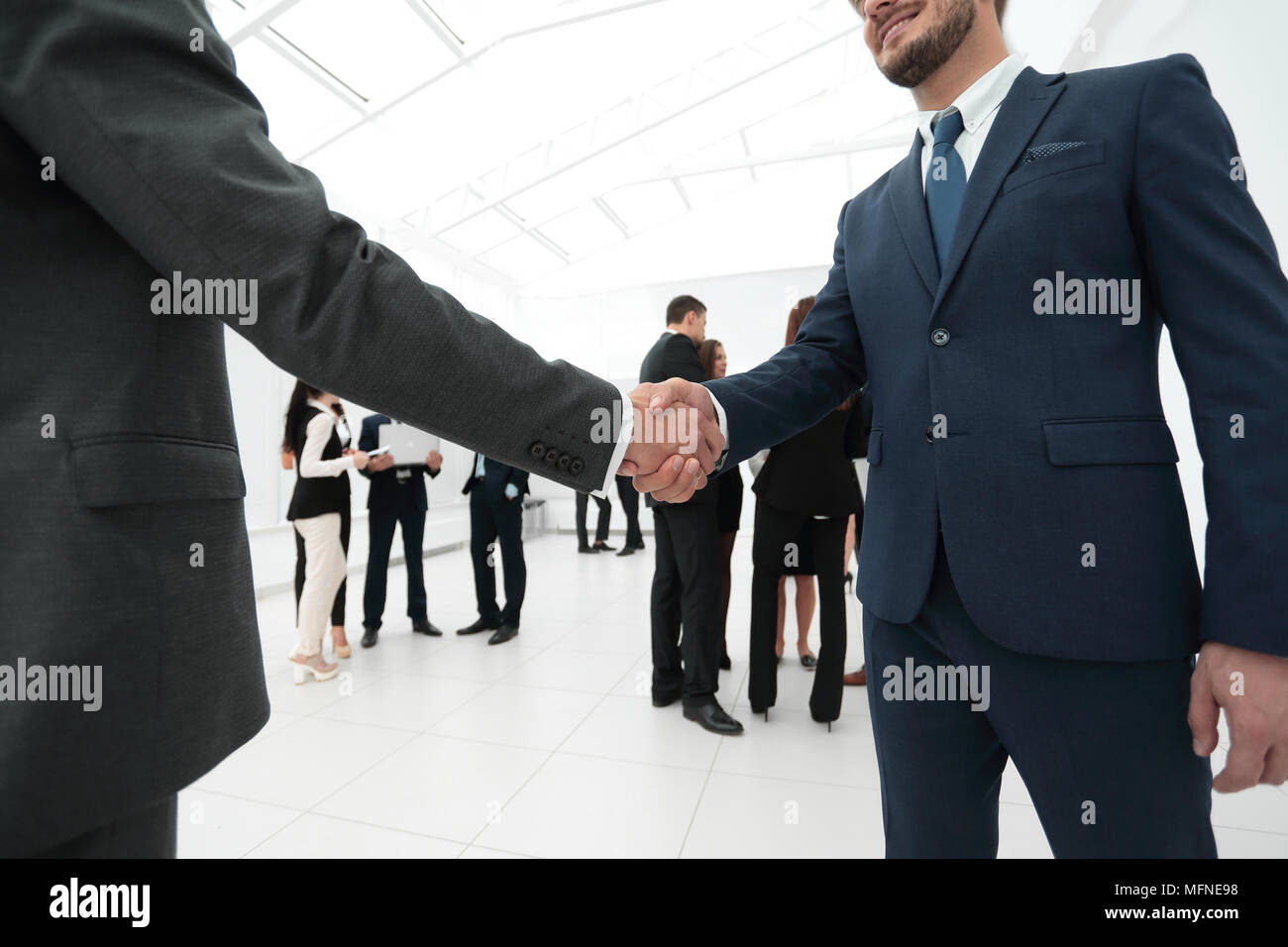closeup of handshake of business partners on the background of business ...