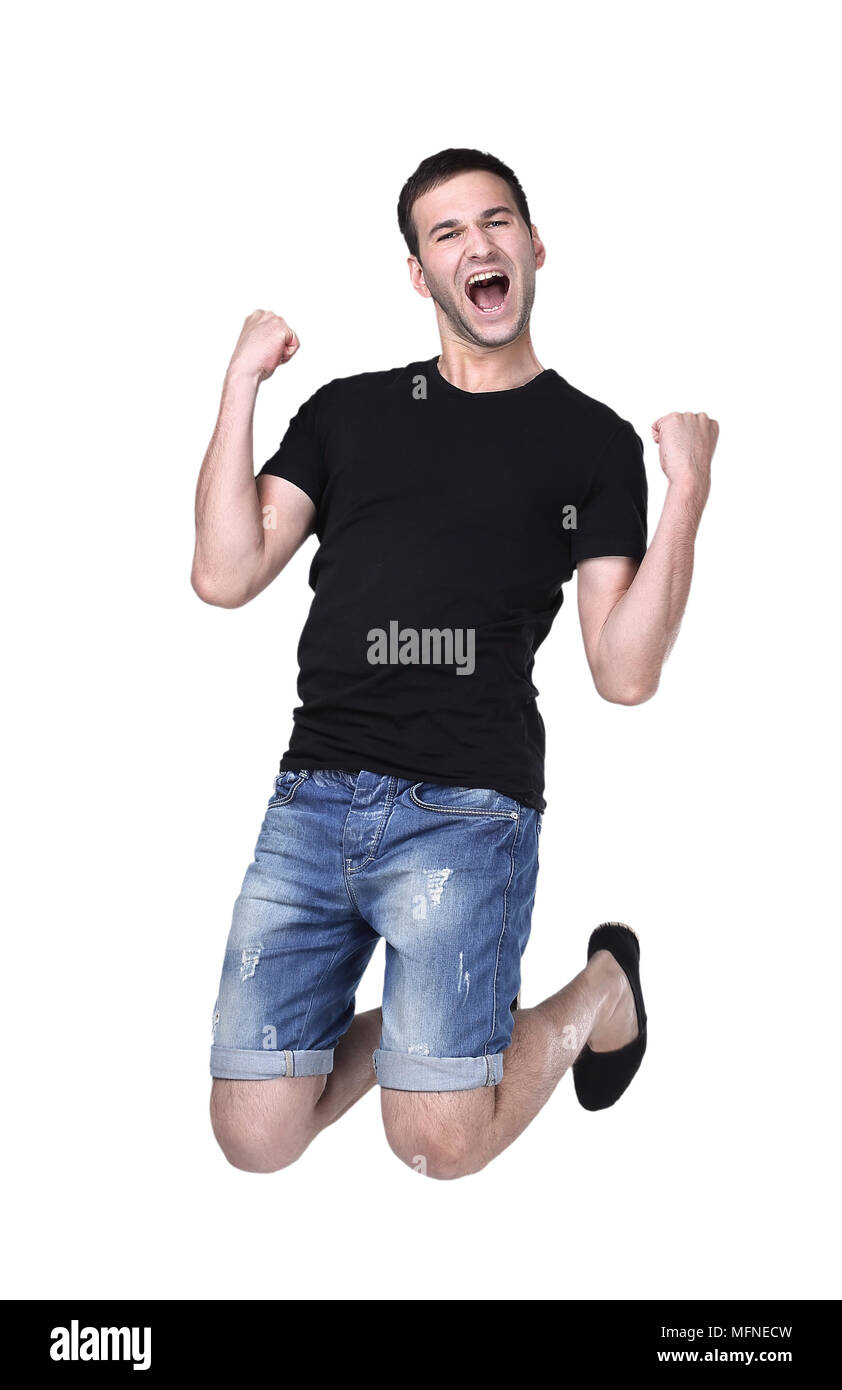 Excited young man jumping isolated over a white background Stock Photo ...