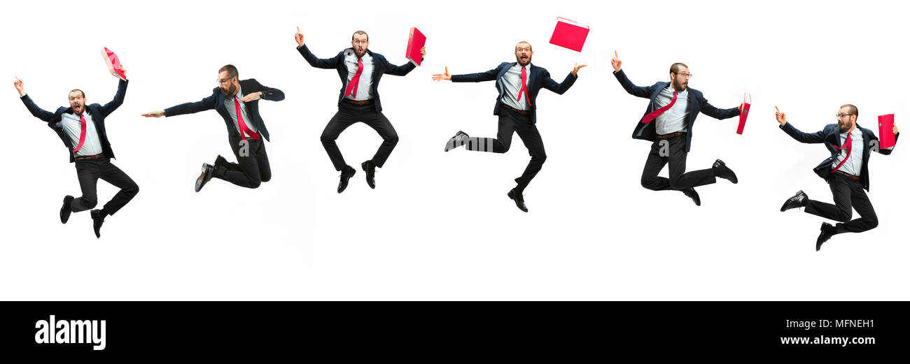 Funny cheerful businessman jumping in air over white background Stock ...