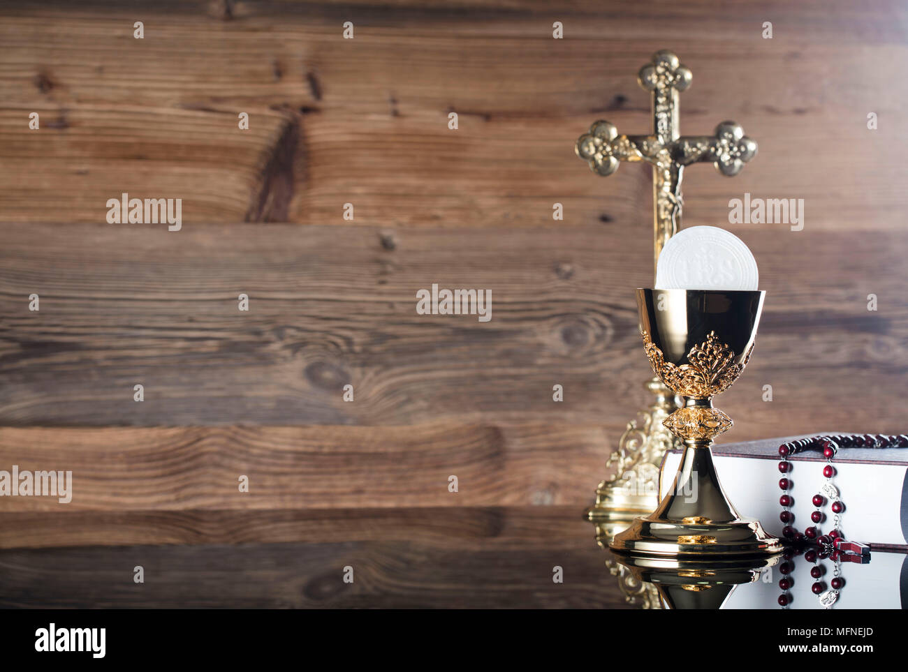 First holy communion theme. The Cross, Holy Bible, rosary and golden ...