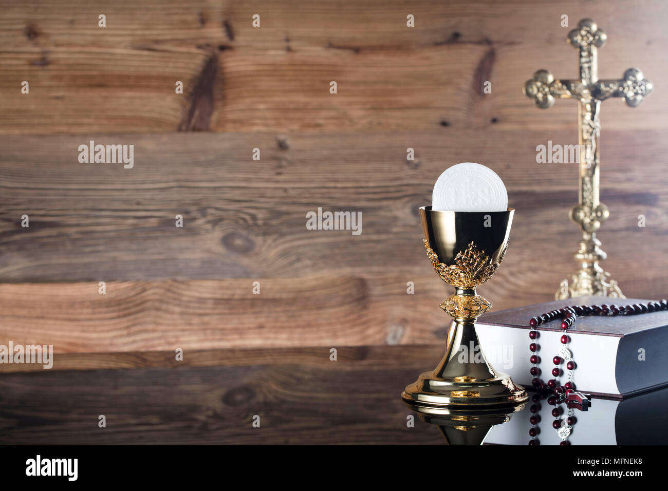 First holy communion theme. The Cross, Holy Bible, rosary and golden ...