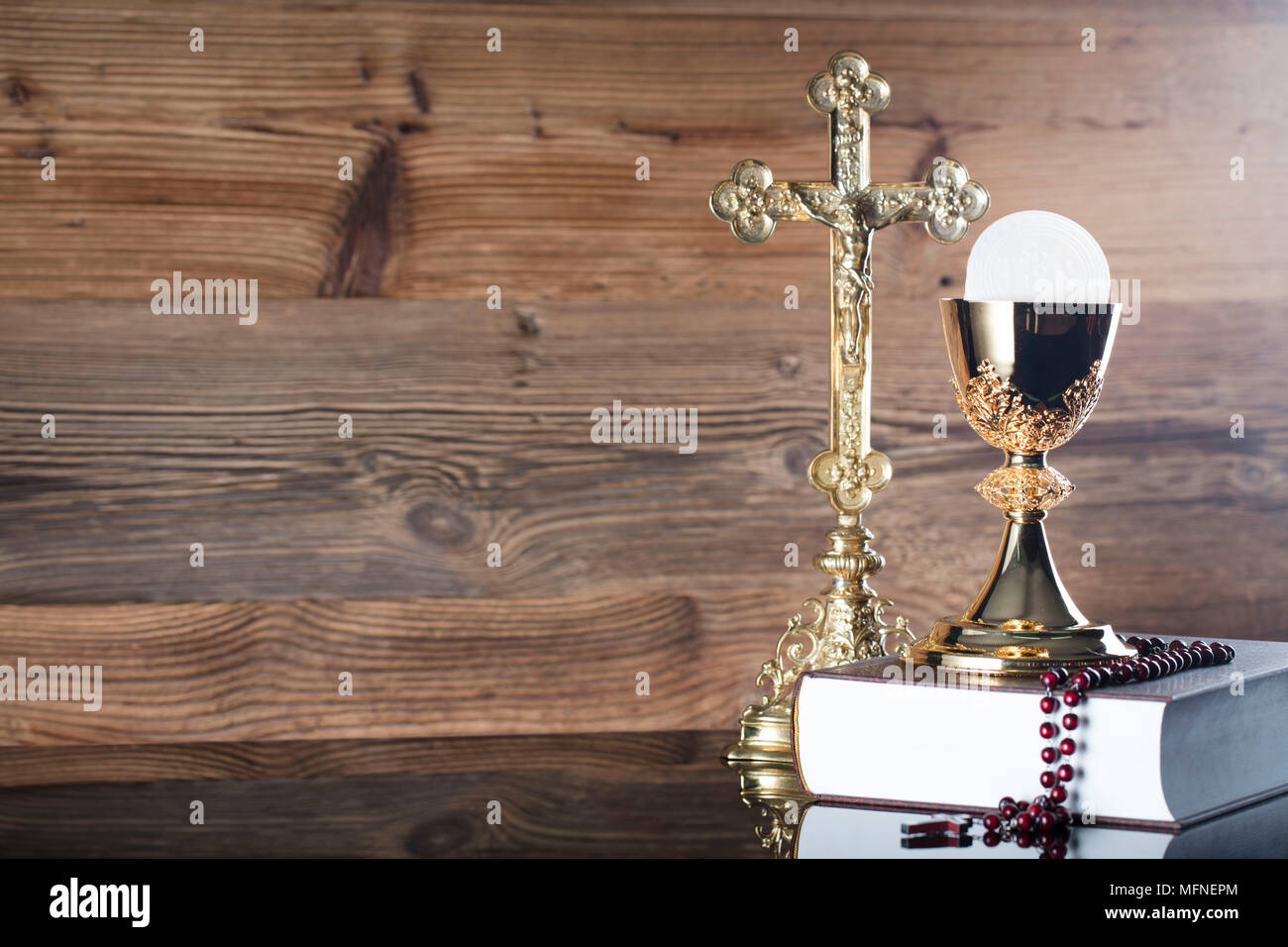 First holy communion theme. The Cross, Holy Bible, rosary and golden ...