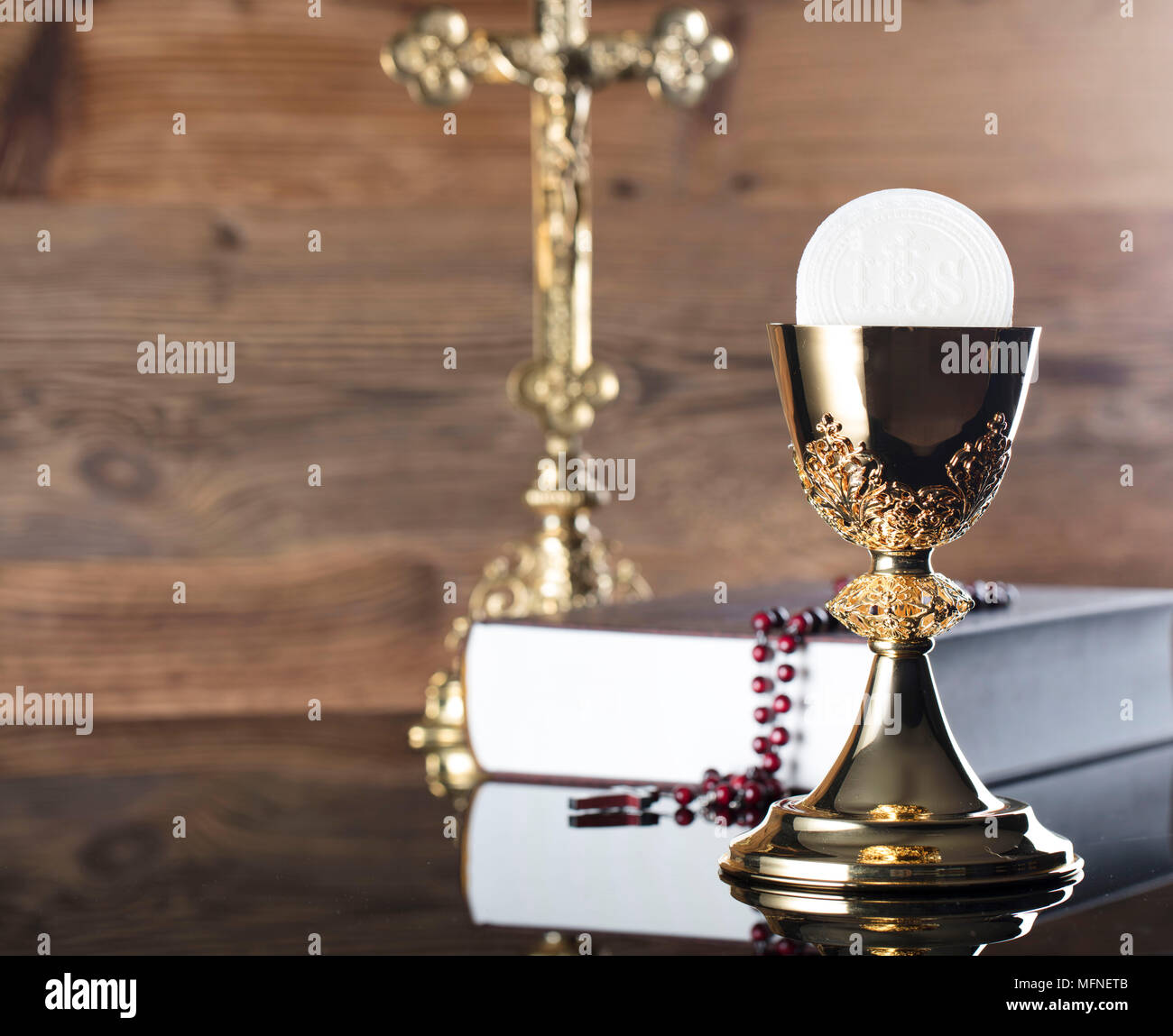 First holy communion theme. The Cross, Holy Bible, rosary and golden ...